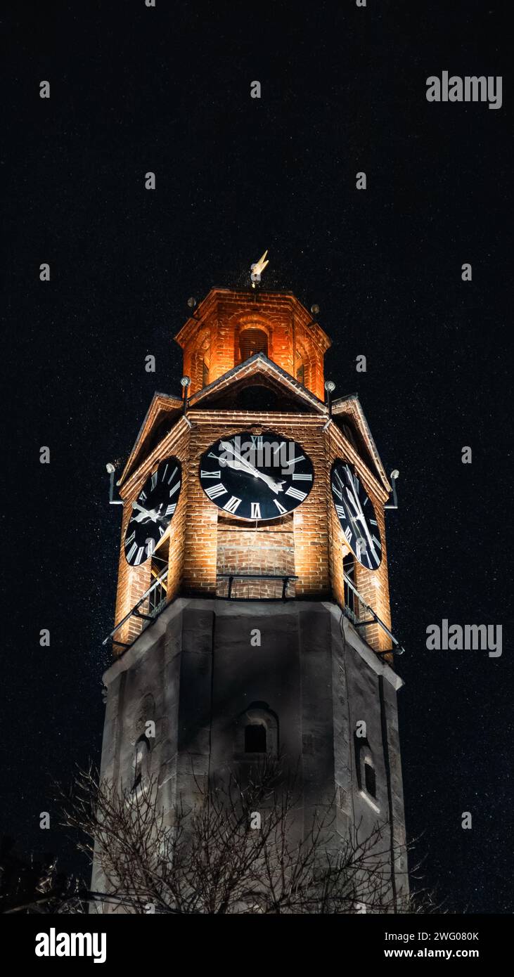 A nighttime view of the illuminated Clock Tower in Pristina, Kosovo ...
