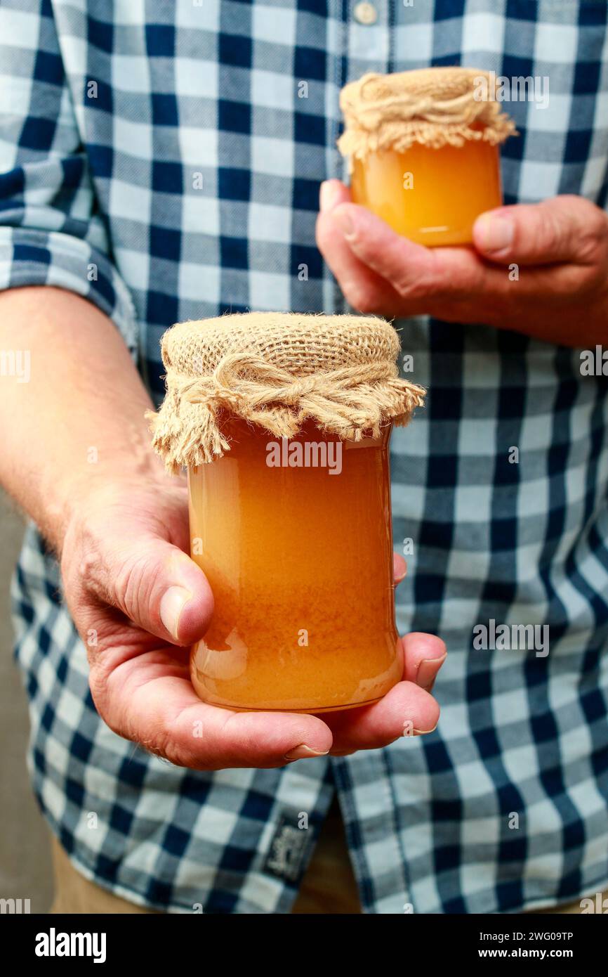 Man holding honey jar hi-res stock photography and images - Alamy
