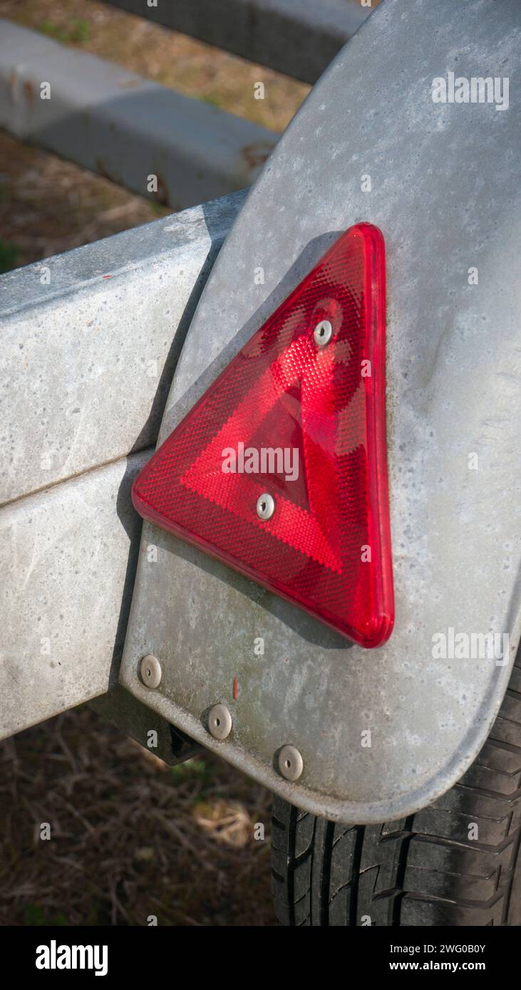 Red triangle warning in wheel Stock Photo - Alamy
