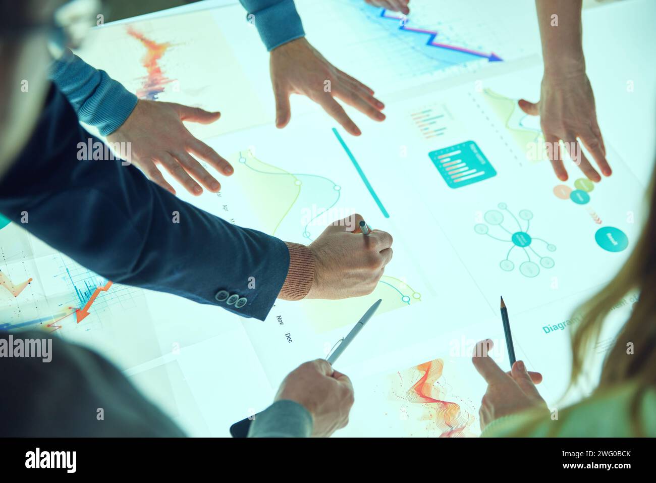 Pointing on important moments. Business people working on startup ...