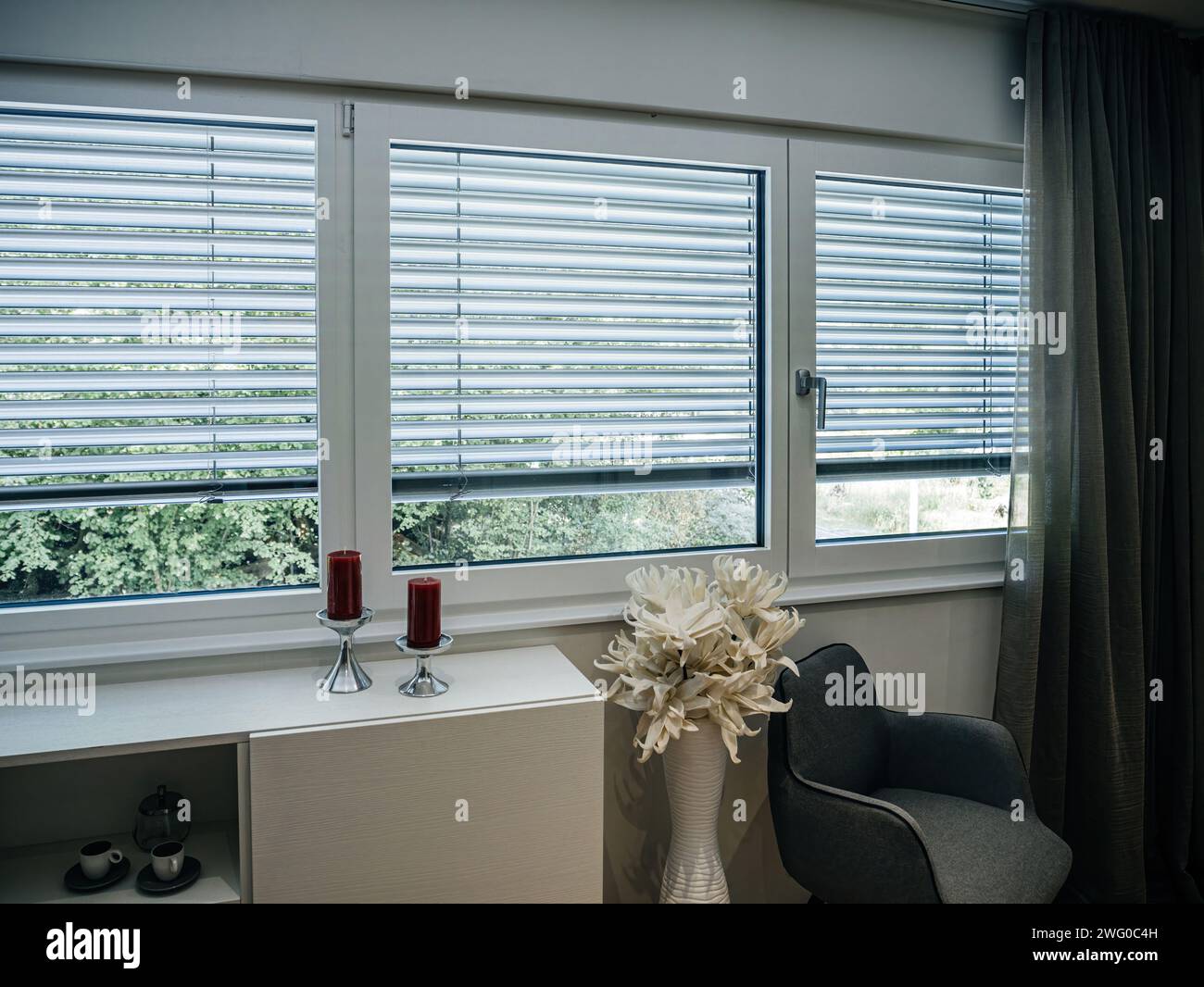 Modern office space with contemporary furniture and louvered windows ...