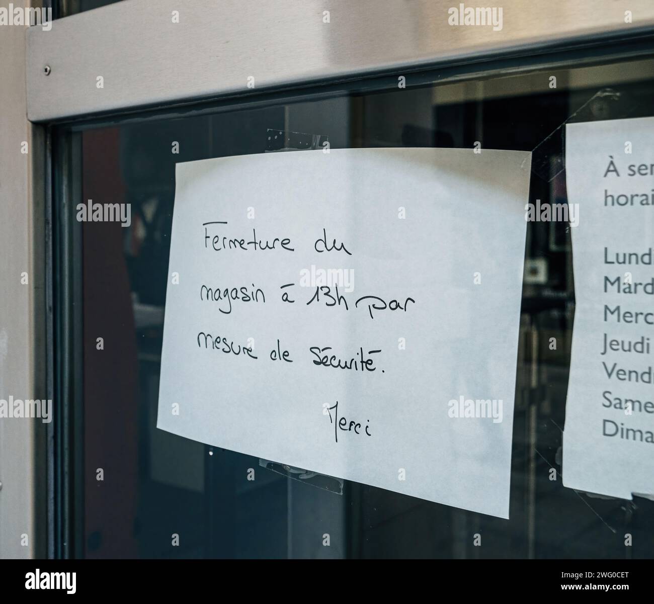 A handwritten closure notice for security measures posted on a ...