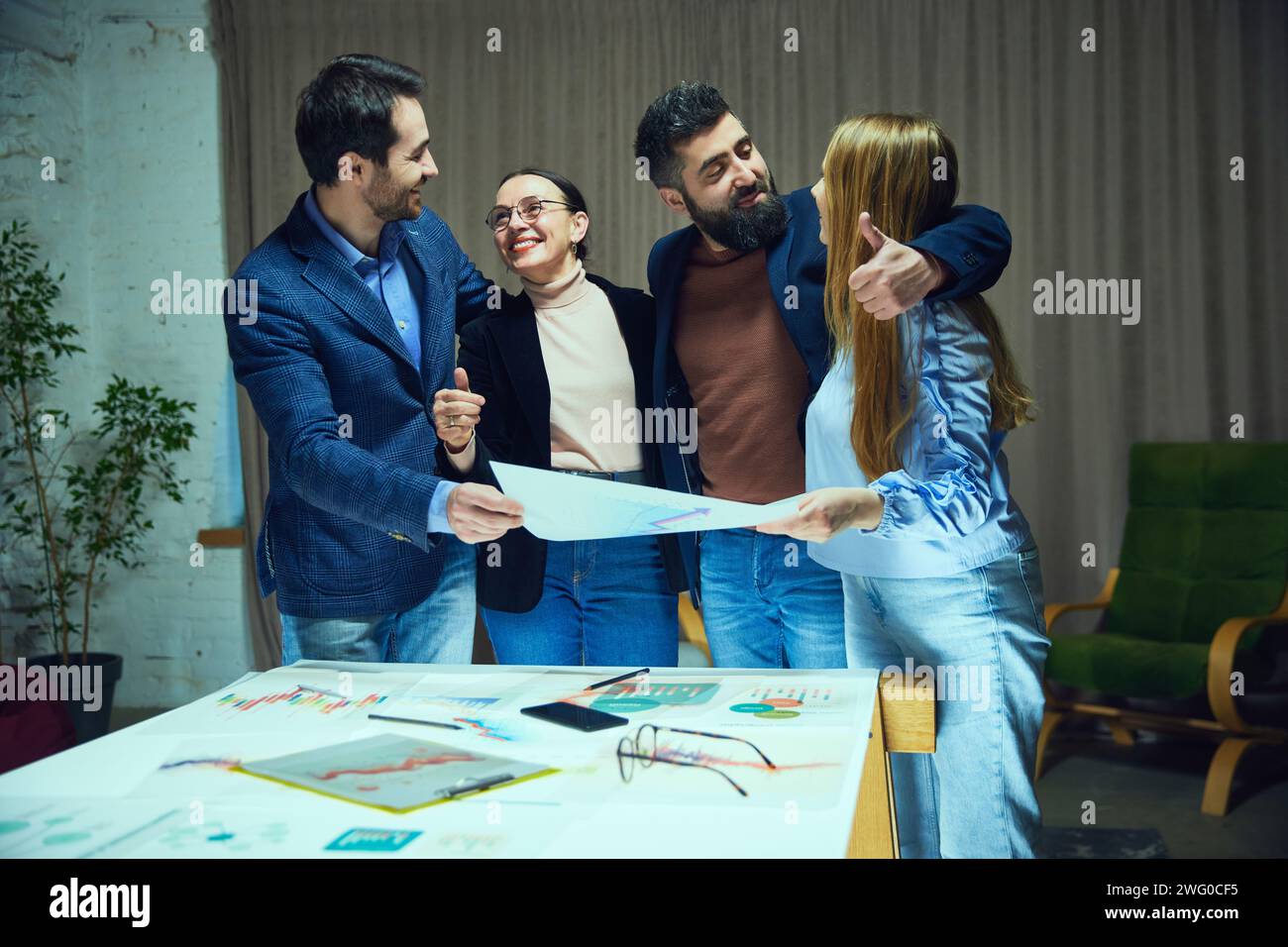 Successful work and cooperation. Employees greeting each other with ...