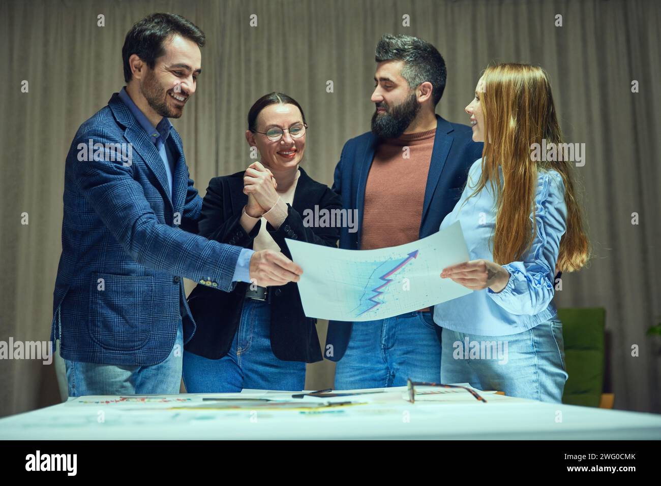Successful work and cooperation. Employees greeting each other with ...