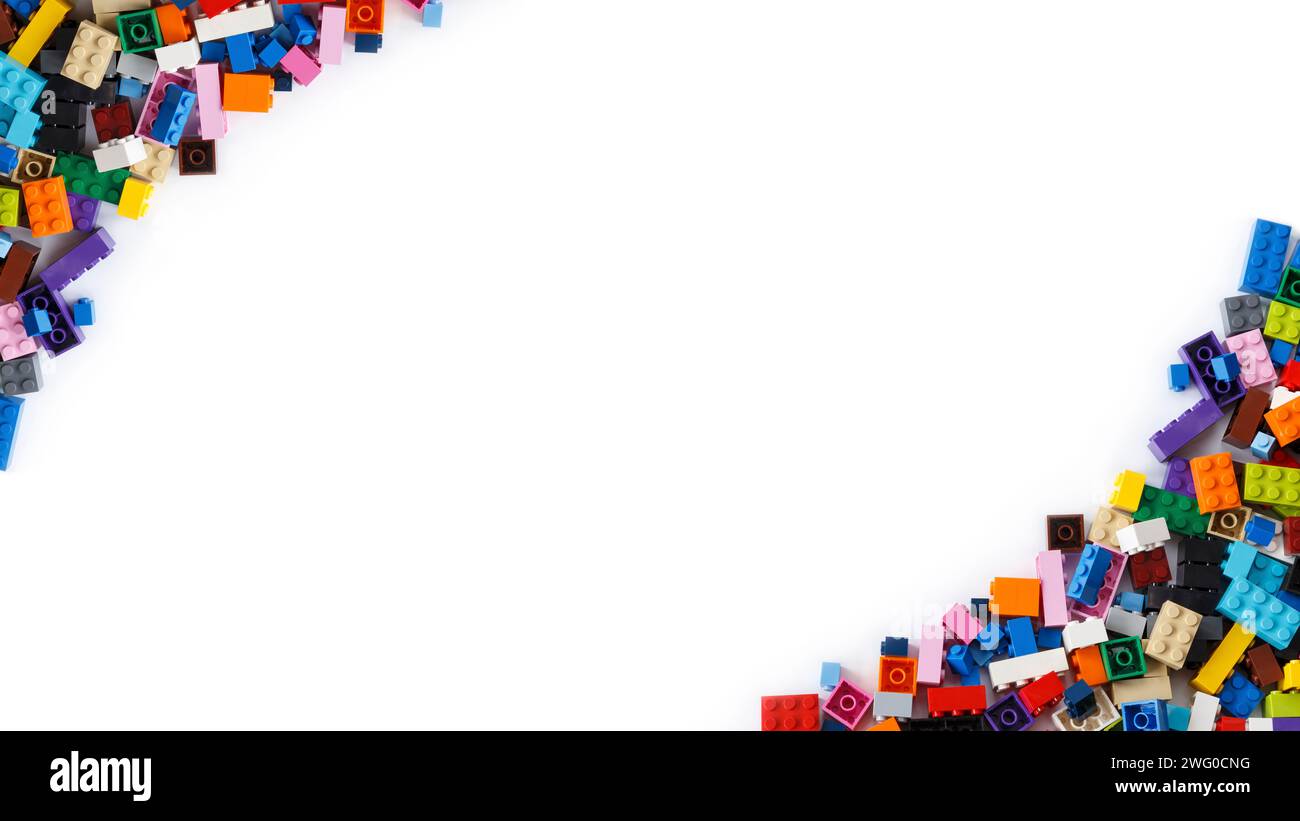 Close-up of cluttered piles of colorful toy bricks viewed from above ...