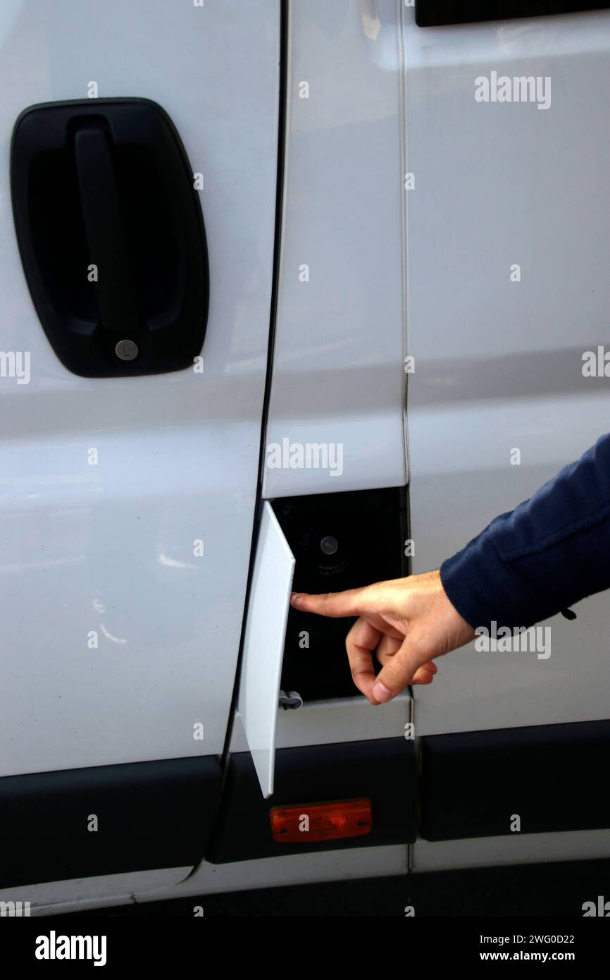 Description: Close-up of a man's hand resting on a woman's back in a ...
