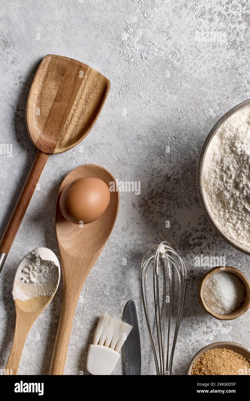 various kitchen tools on light grey table top view Stock Photo - Alamy