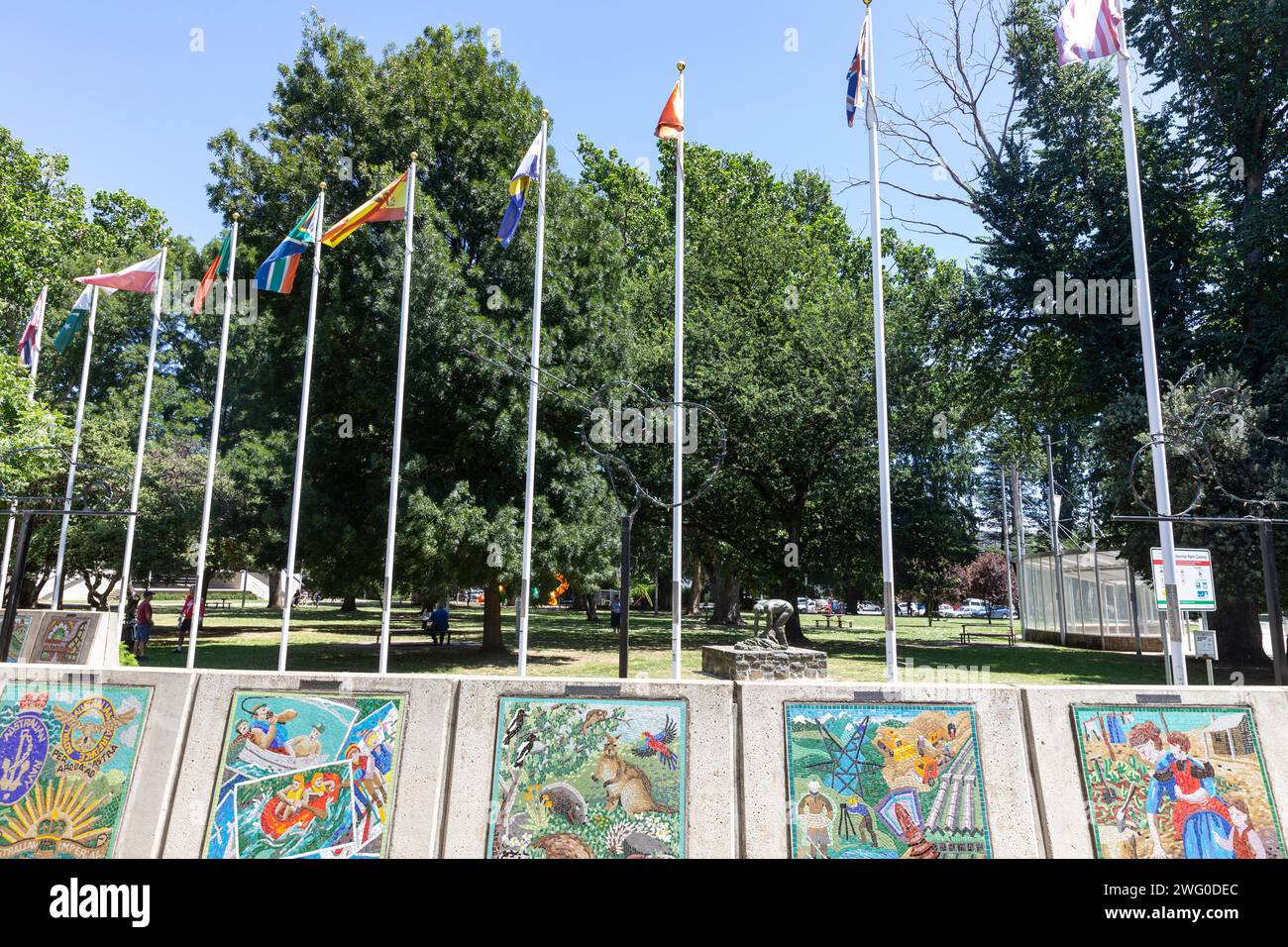Cooma town centre with avenue of flags and timeline of mosaics at ...