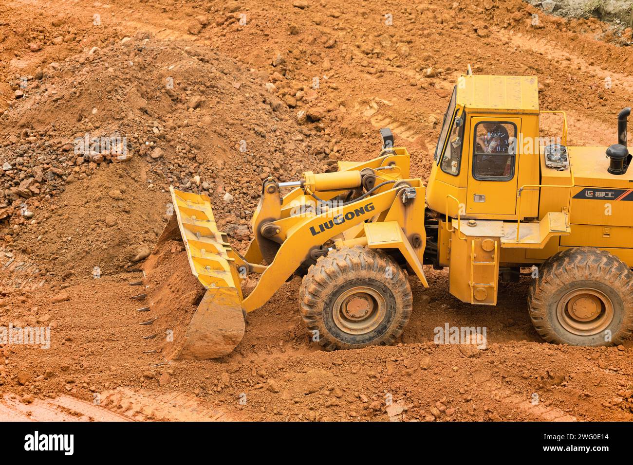 Construction zone excavator loading dump hi-res stock photography and ...