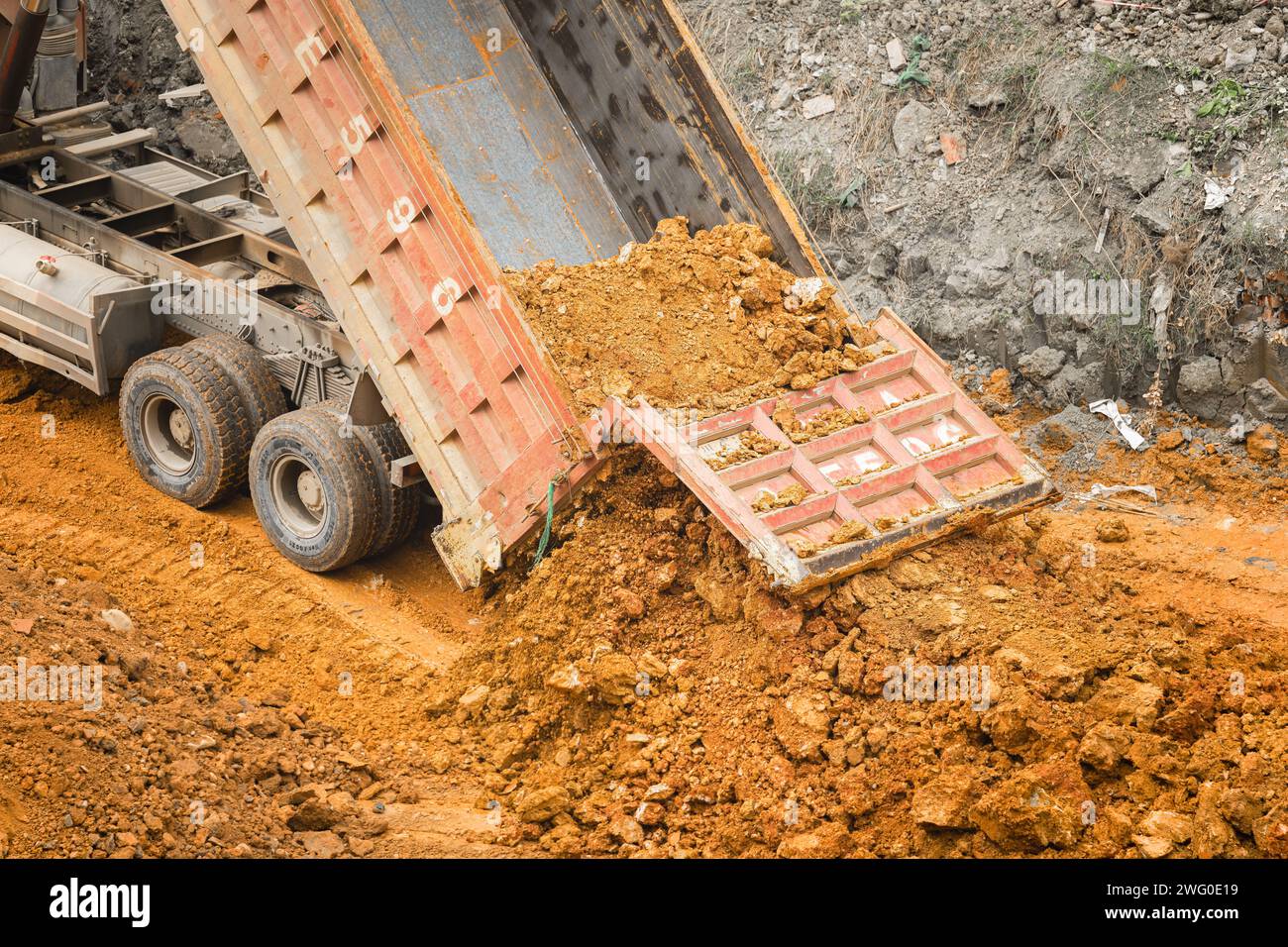 Excavator digging the land Stock Photo - Alamy