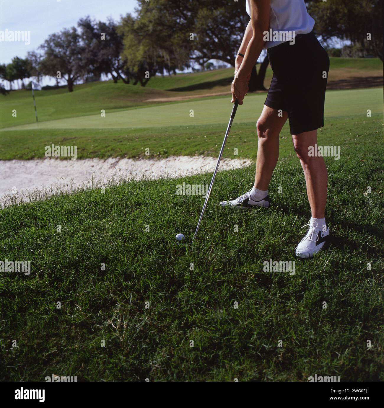 A woman golfing Stock Photo - Alamy