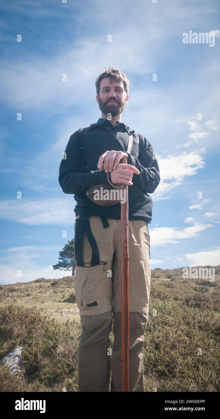 White man hiking in a mountain Stock Photo - Alamy