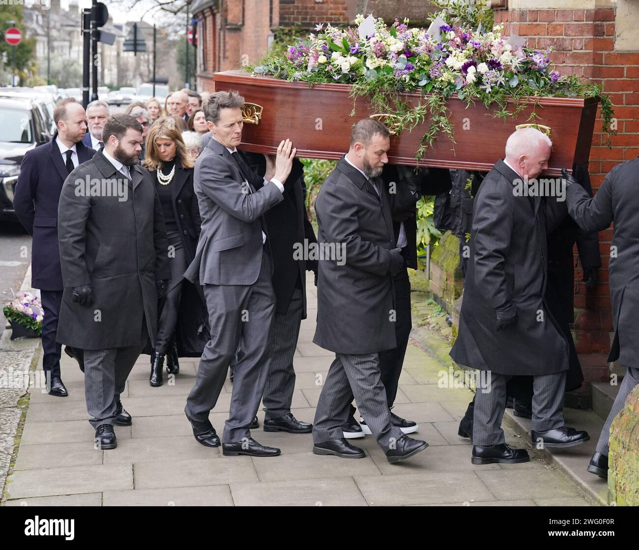 Kate Garraway follows the coffin into the funeral service of her ...
