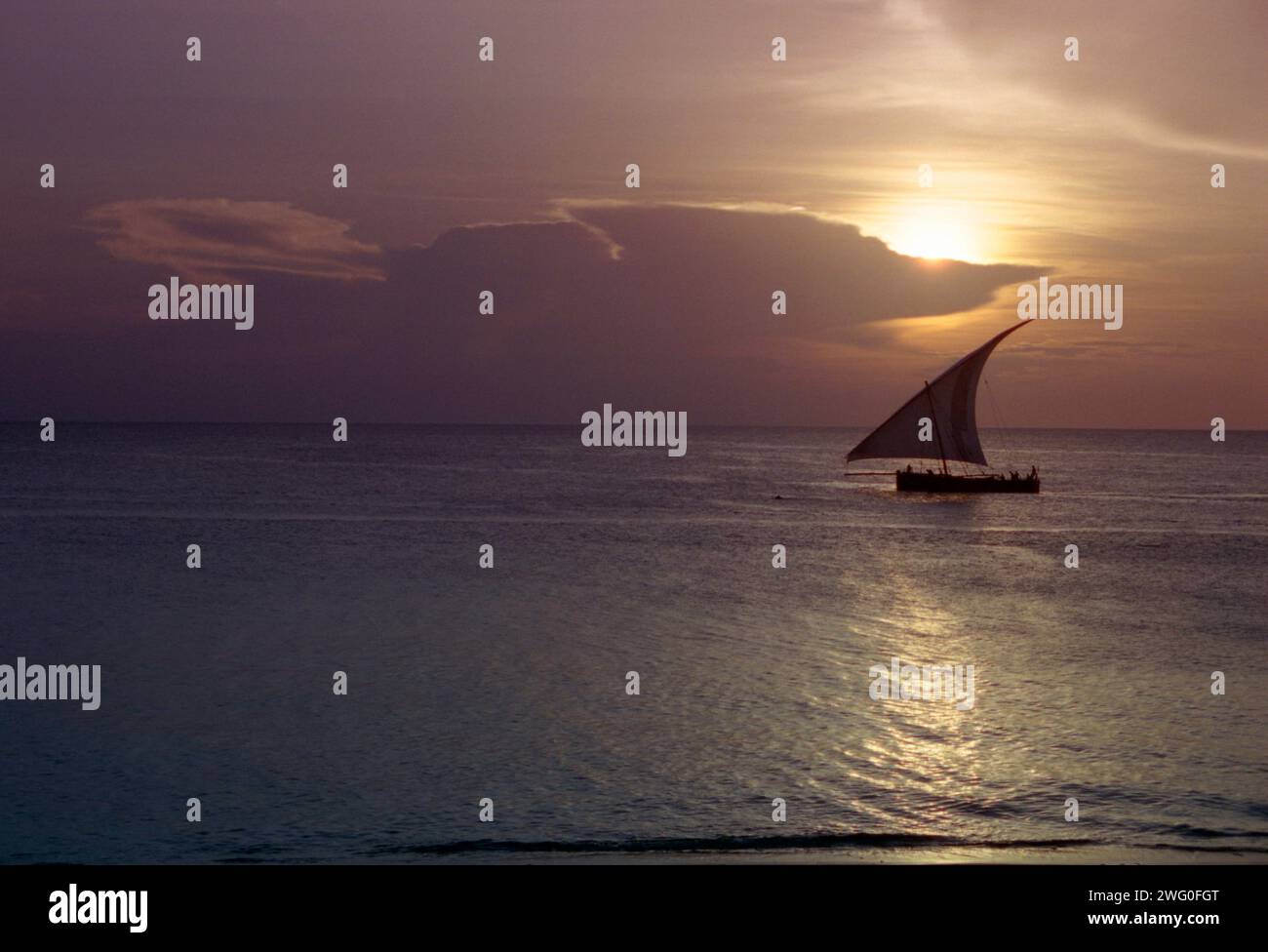 A Dhow boat sailing near Stone Town, Zanzibar, Tanzania Stock Photo - Alamy
