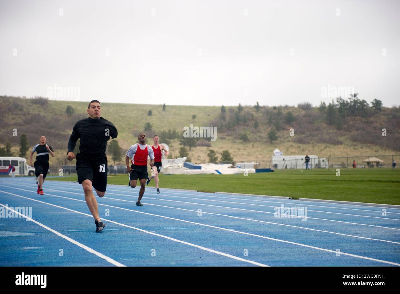 Disabled athletes race to finish line during a track meet Stock Photo ...