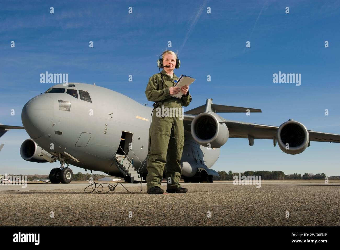A U.S. Air Force loadmaster conducts a preflight checklist during ...