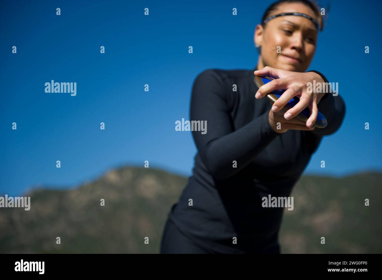 A female athlete prepares to launch a discus during track practice ...