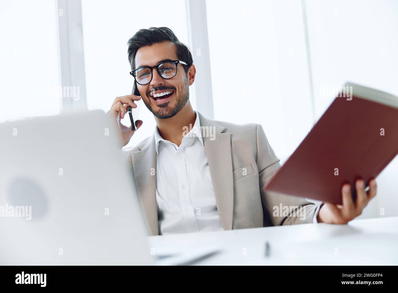 Office man phone workplace talk document computer professional ...