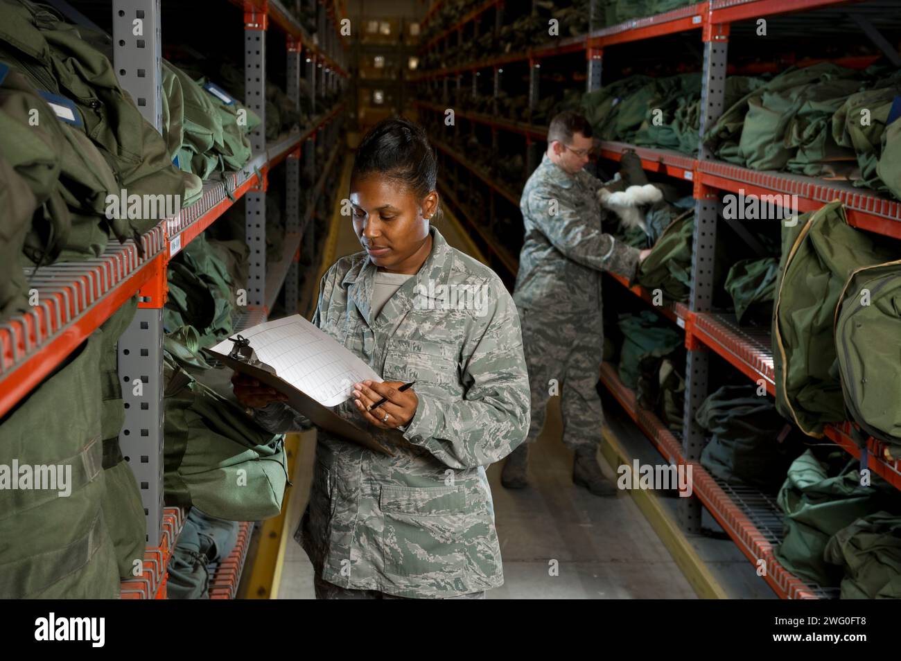 A U.S. Air Force Staff Sgt. takes inventory of the military issued gear ...
