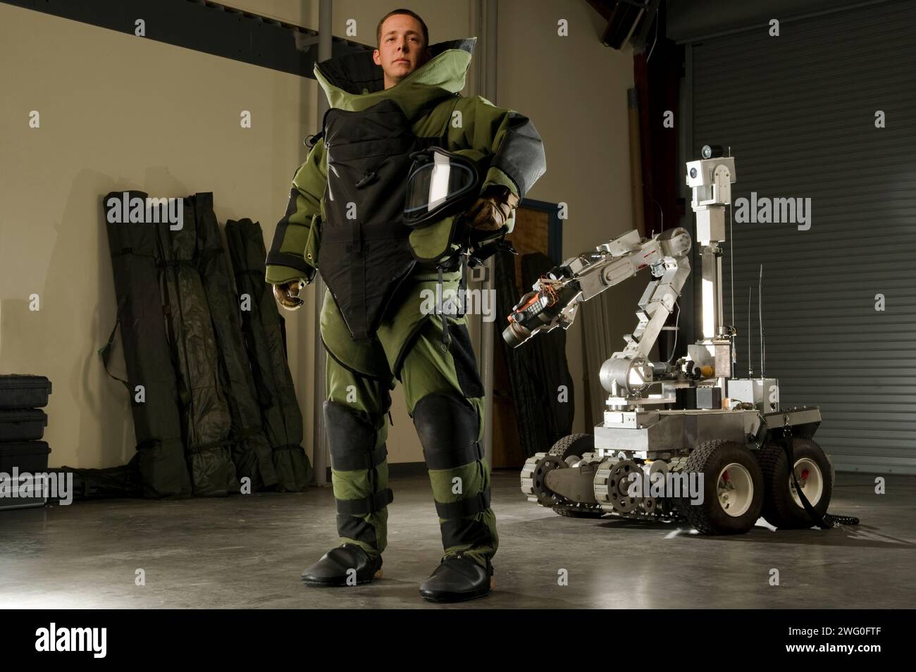 A U.S. Air Force explosive ordinance disposal team member dressed in ...