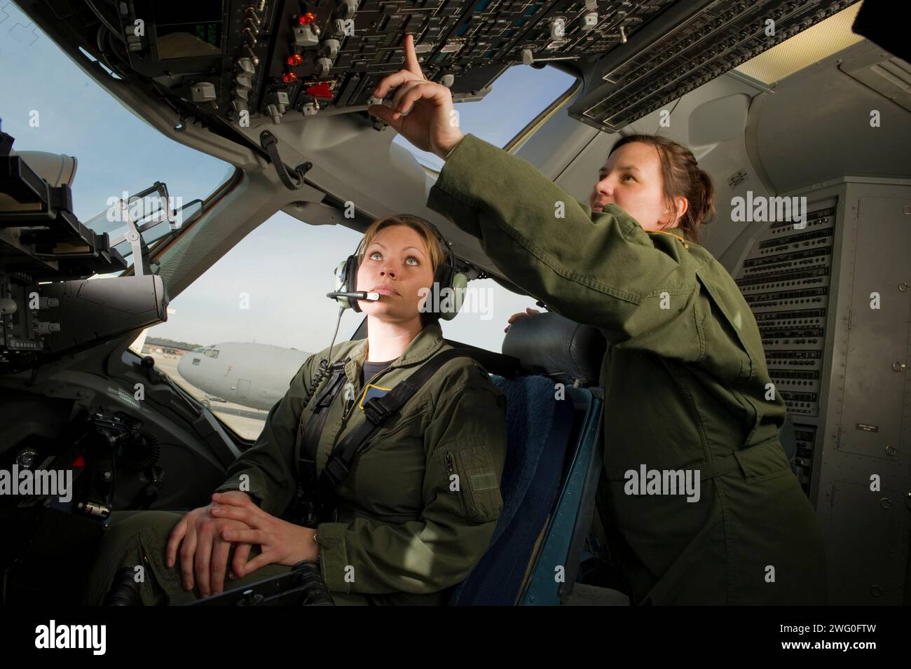 U.S. Air Force pilots conduct their preflight checklist during engine ...