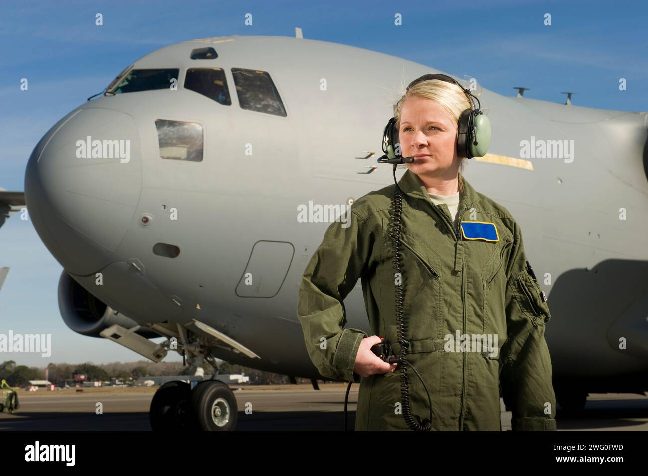 A U.S. Air Force loadmaster conducts a preflight checklist during engine start up Stock Photo ...