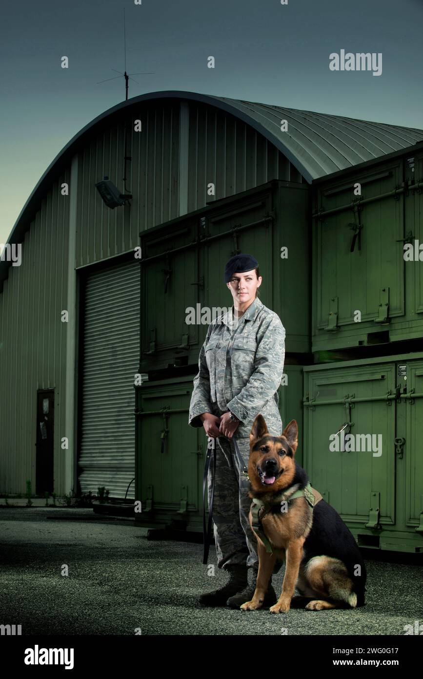 A Caucasian, female Air Force Security Forces Airman in uniform gives ...