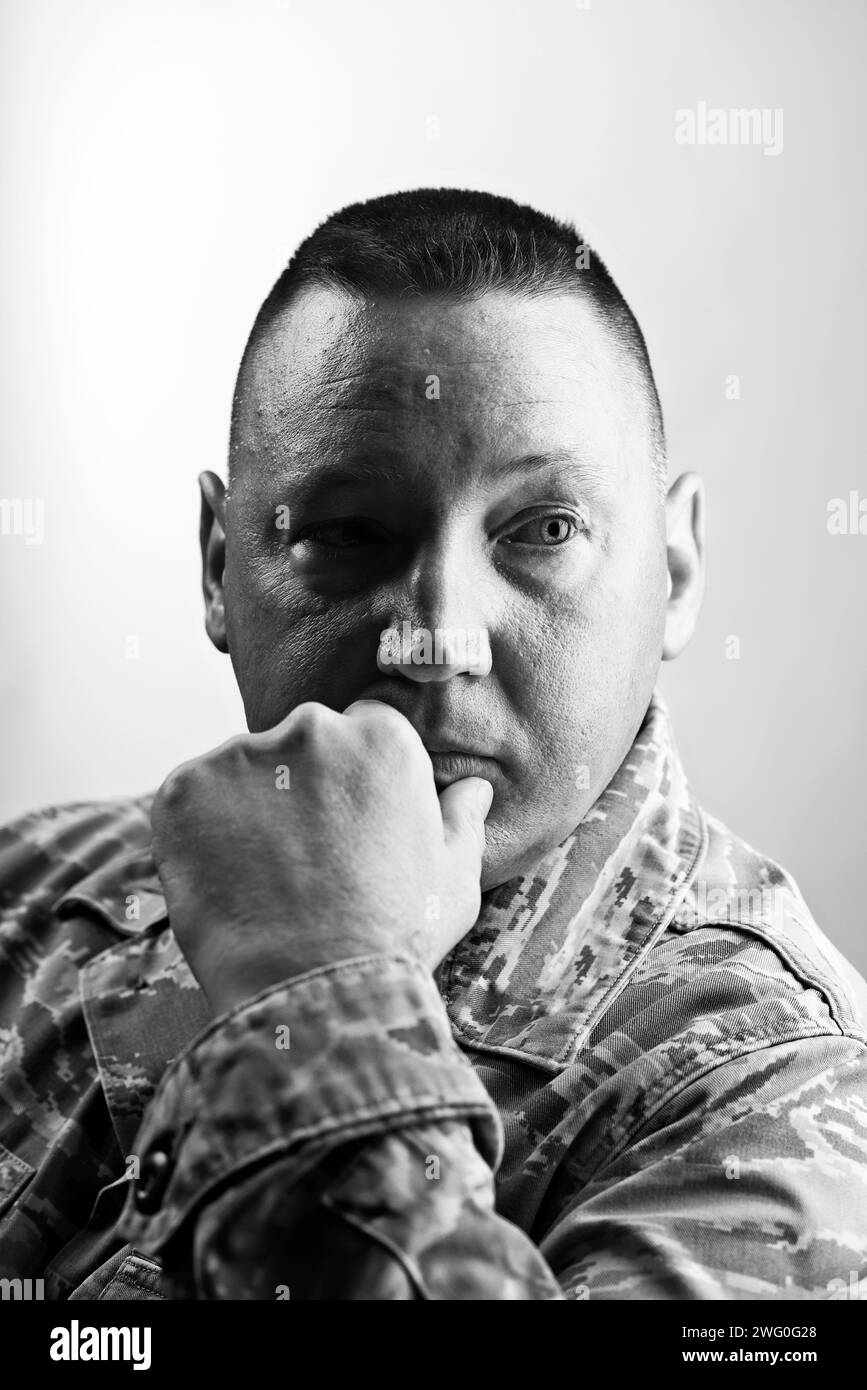 A Caucasian, male, Air Force Security Forces Airman in uniform sits for ...