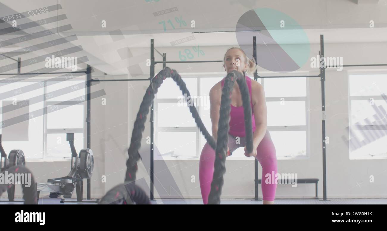 Image of data on interface over caucasian woman cross training with ...