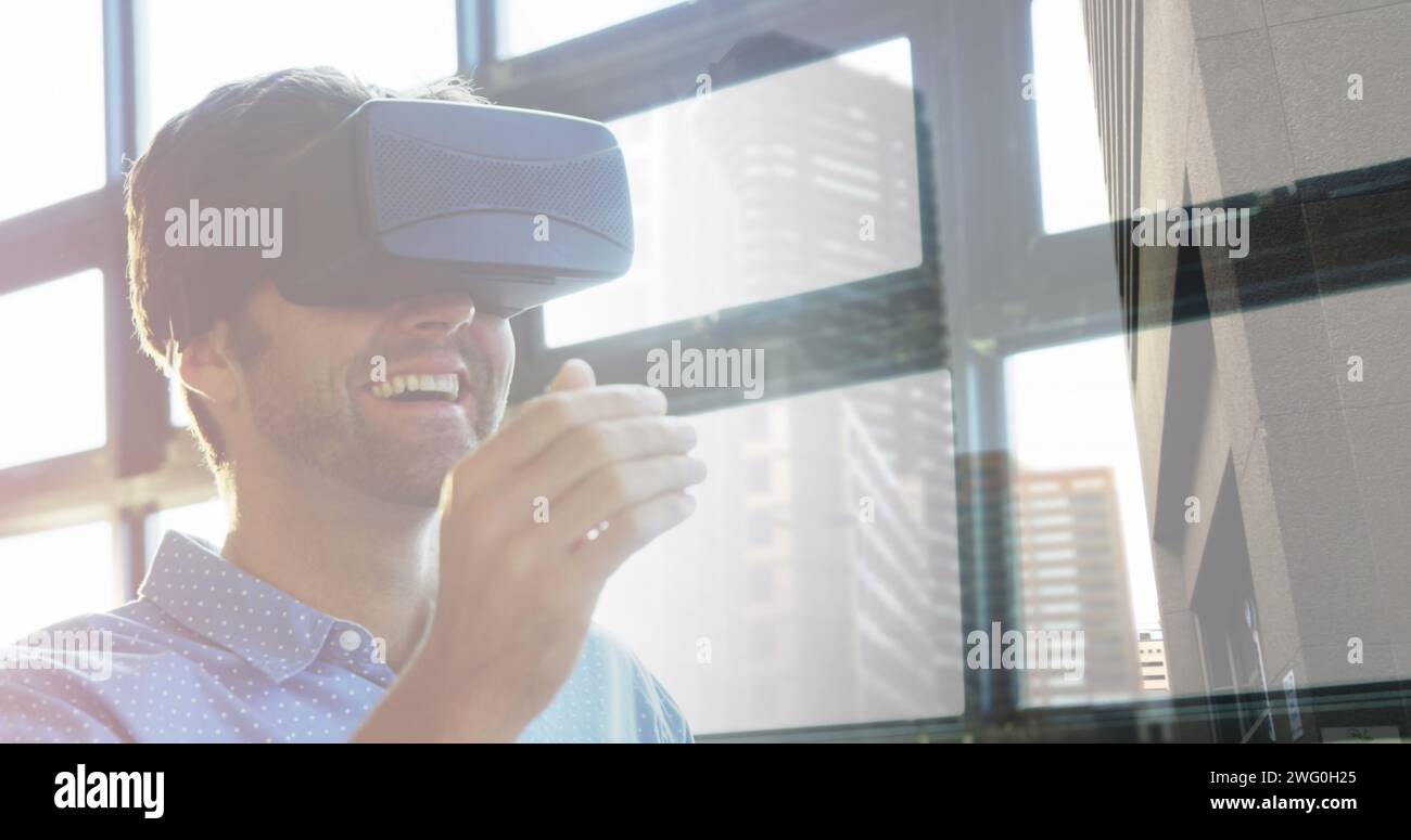 Image of caucasian businessman in vr headset over people walking and ...