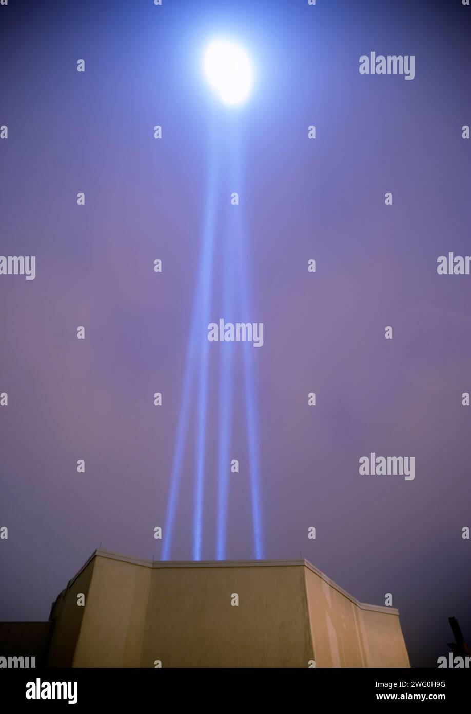 Four high intensity lights are projected into a misty night sky Stock ...