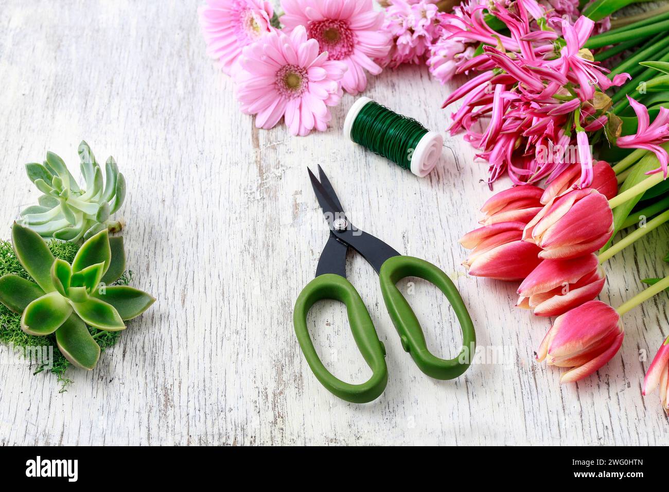 Florist workplace: flowers and accessories. Hobby time Stock Photo - Alamy