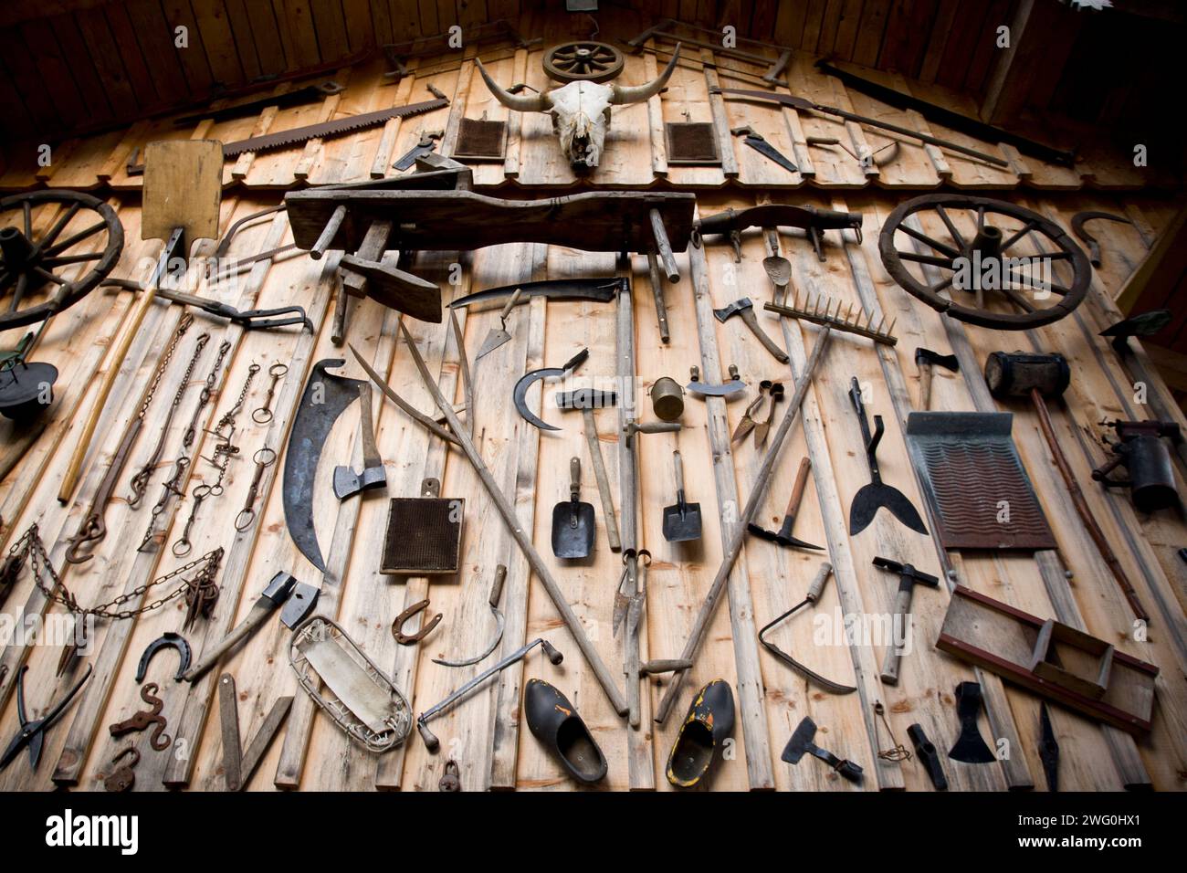 Tools and a skull hang on the wall of an Austrian house, St. Agatha ...