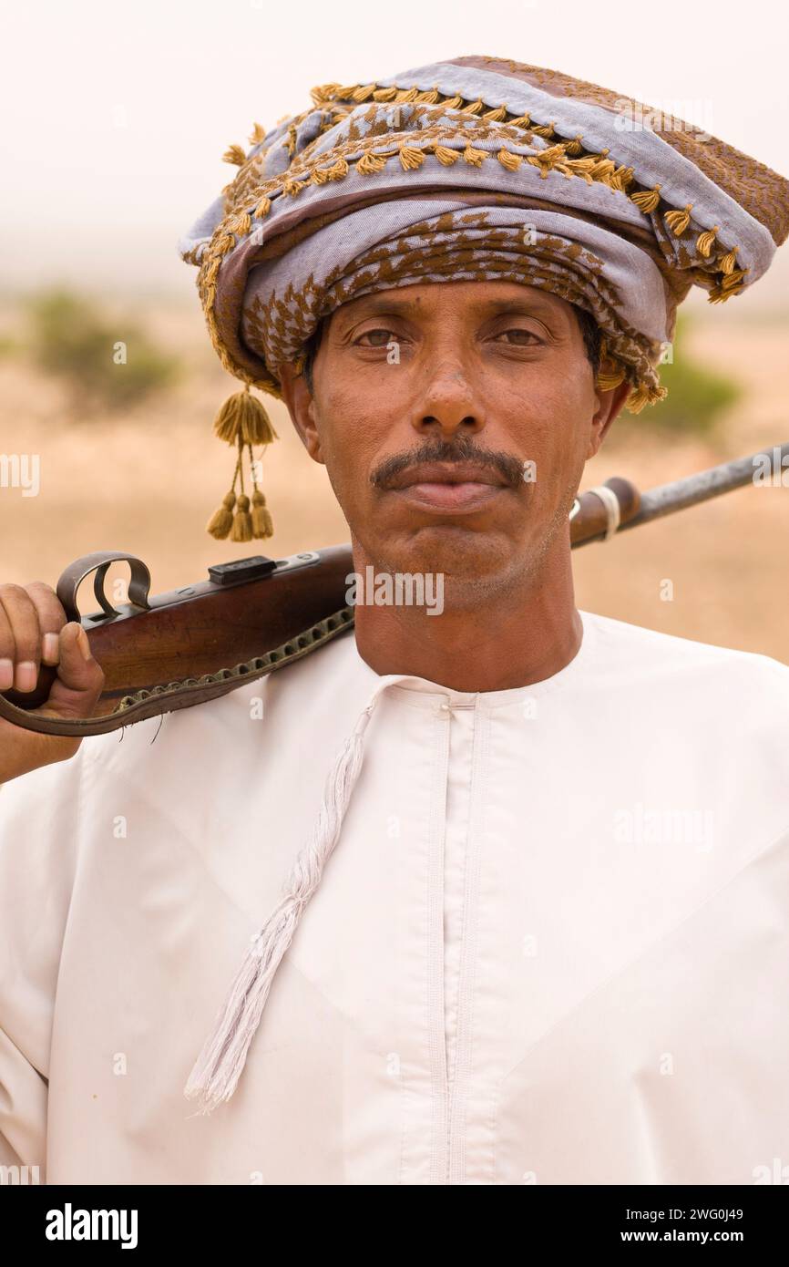 Portrait of a bedouin man with his rifle, Jabal Samhan, Oman Stock ...