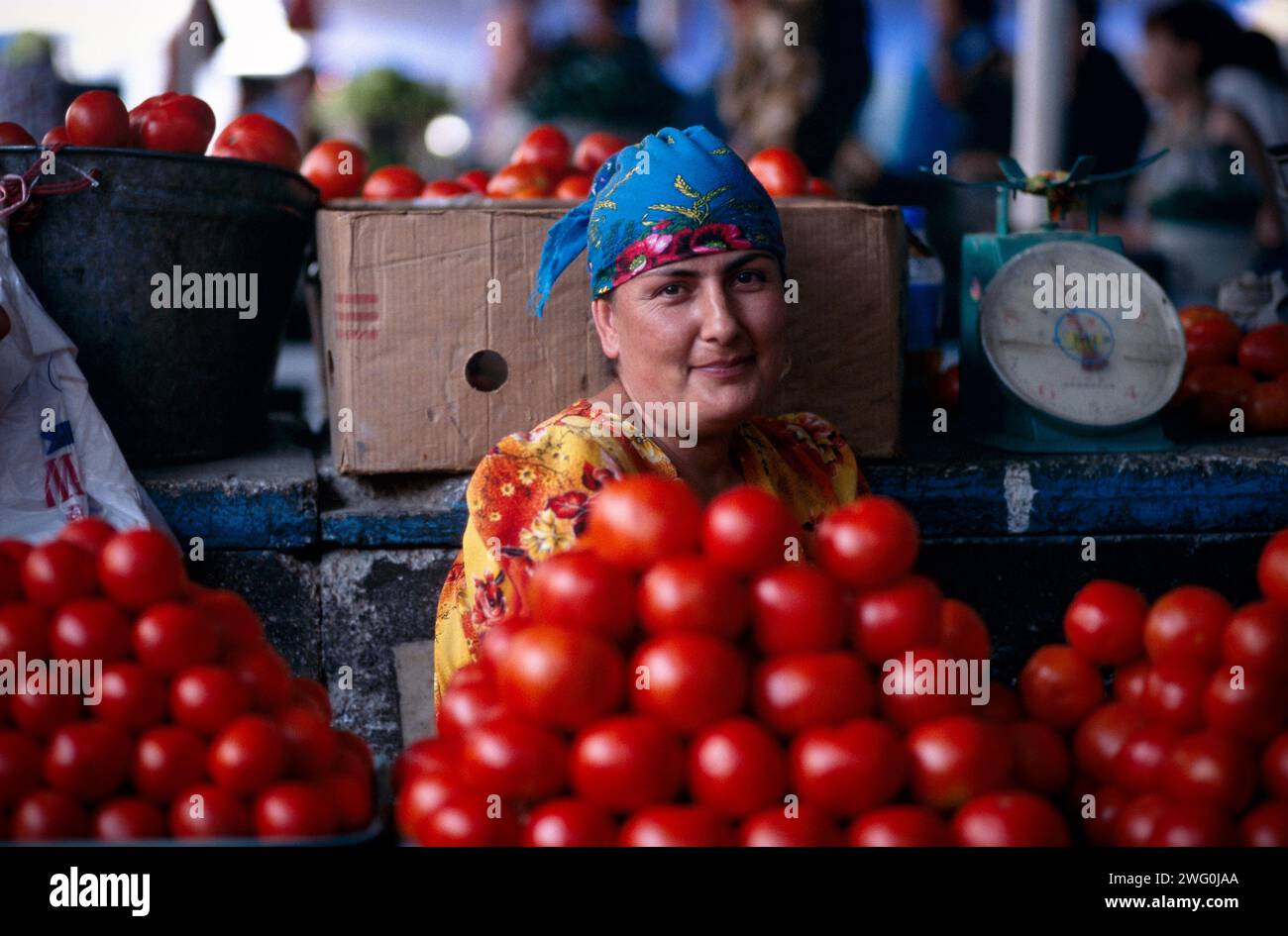A Tajik woman selling tomatoes at the market in Dushanbe, Tajikistan ...