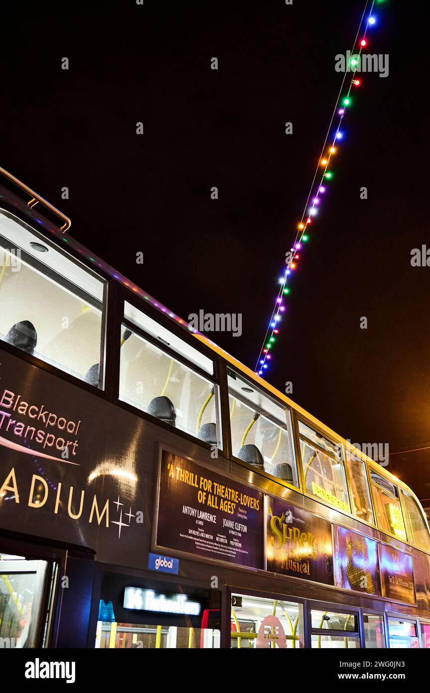 Blackpool bus waiting at terminus at night during the illuminations ...