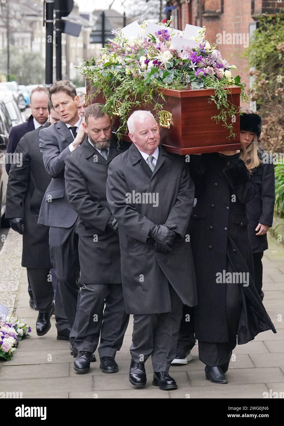 The coffin of Derek Draper is carried into St Mary the Virgin church in ...