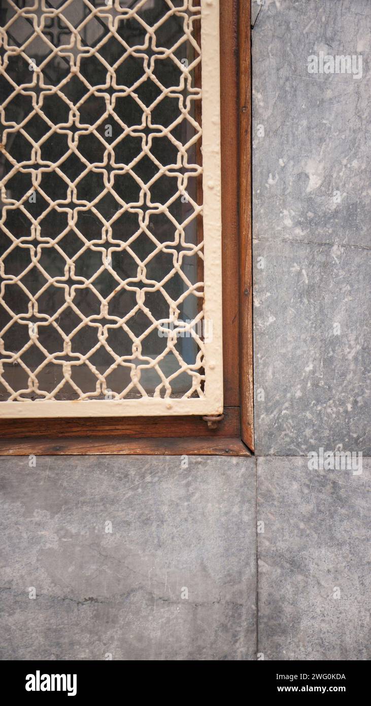 Metal graphic grid in shop window Stock Photo - Alamy