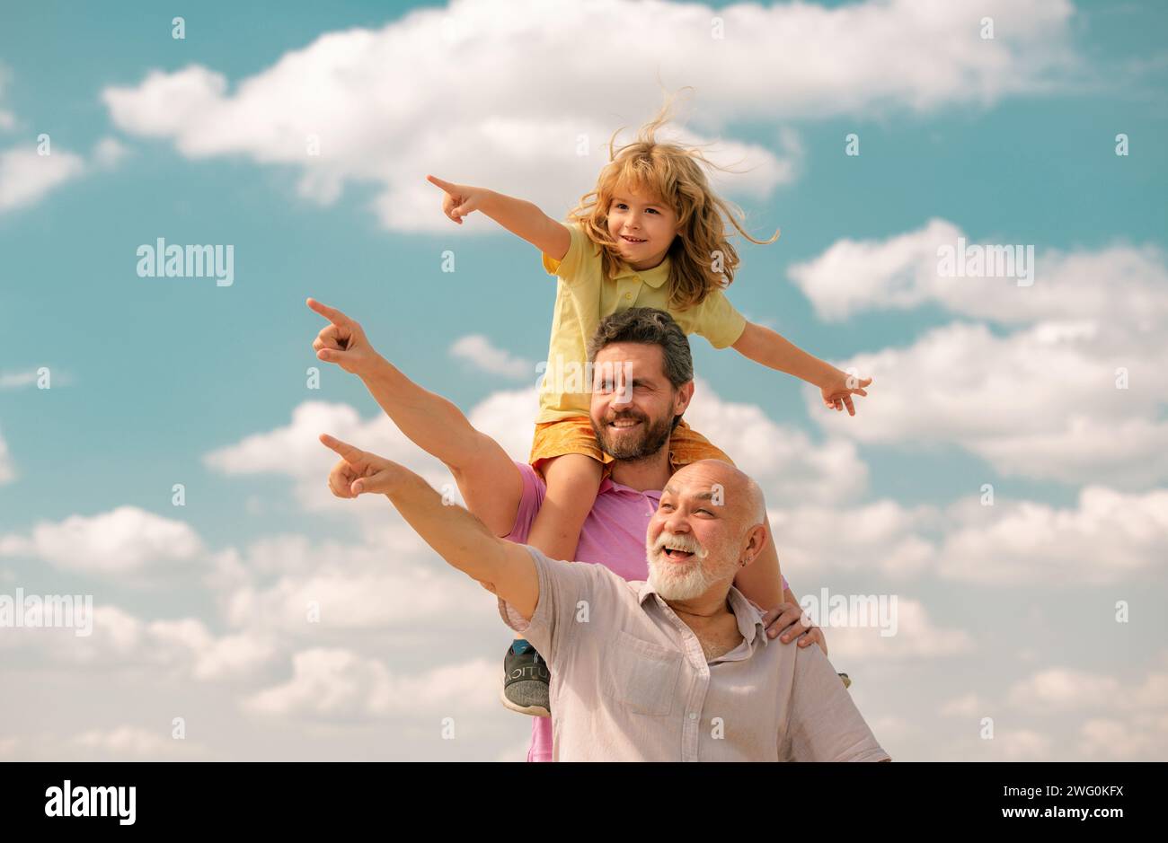 Father and son with grandfather was excited with pointing finger. Hand ...