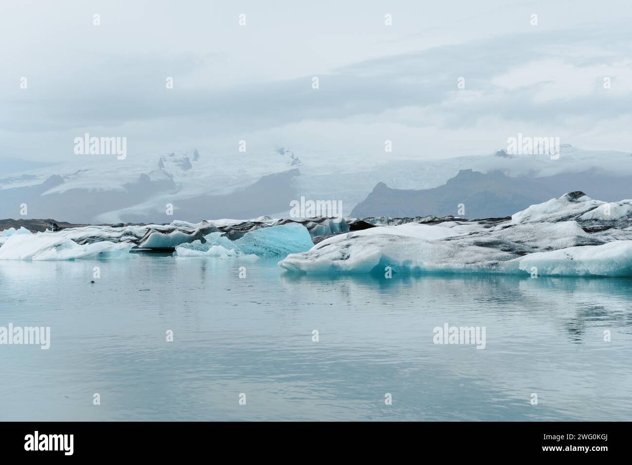 Cold arctic environment floating icebergs and snow covered mountains ...