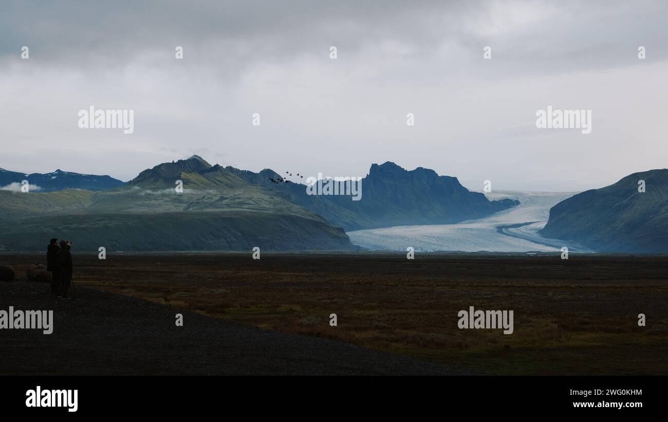 Road near Iceland mountains surround natural remote glacial river Stock ...