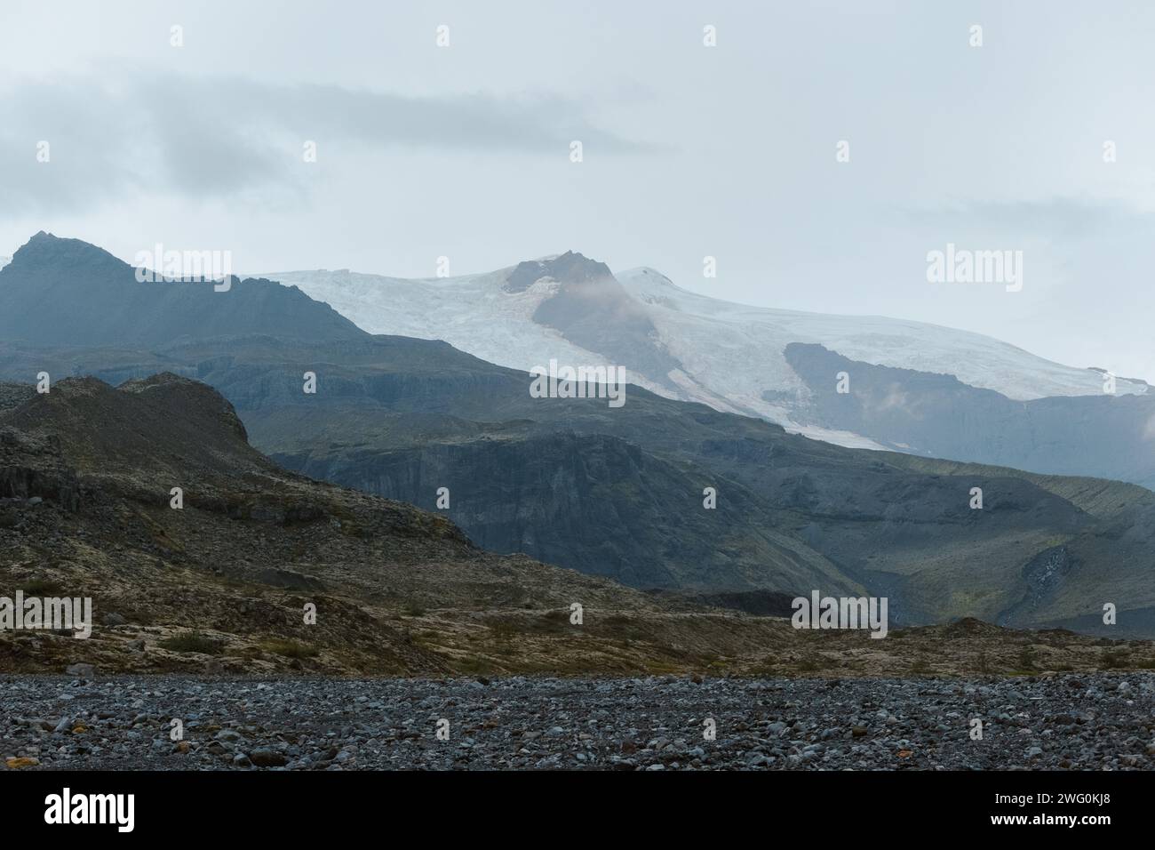 Unique layered glacier landscape with gray hues and rocky ground Stock ...