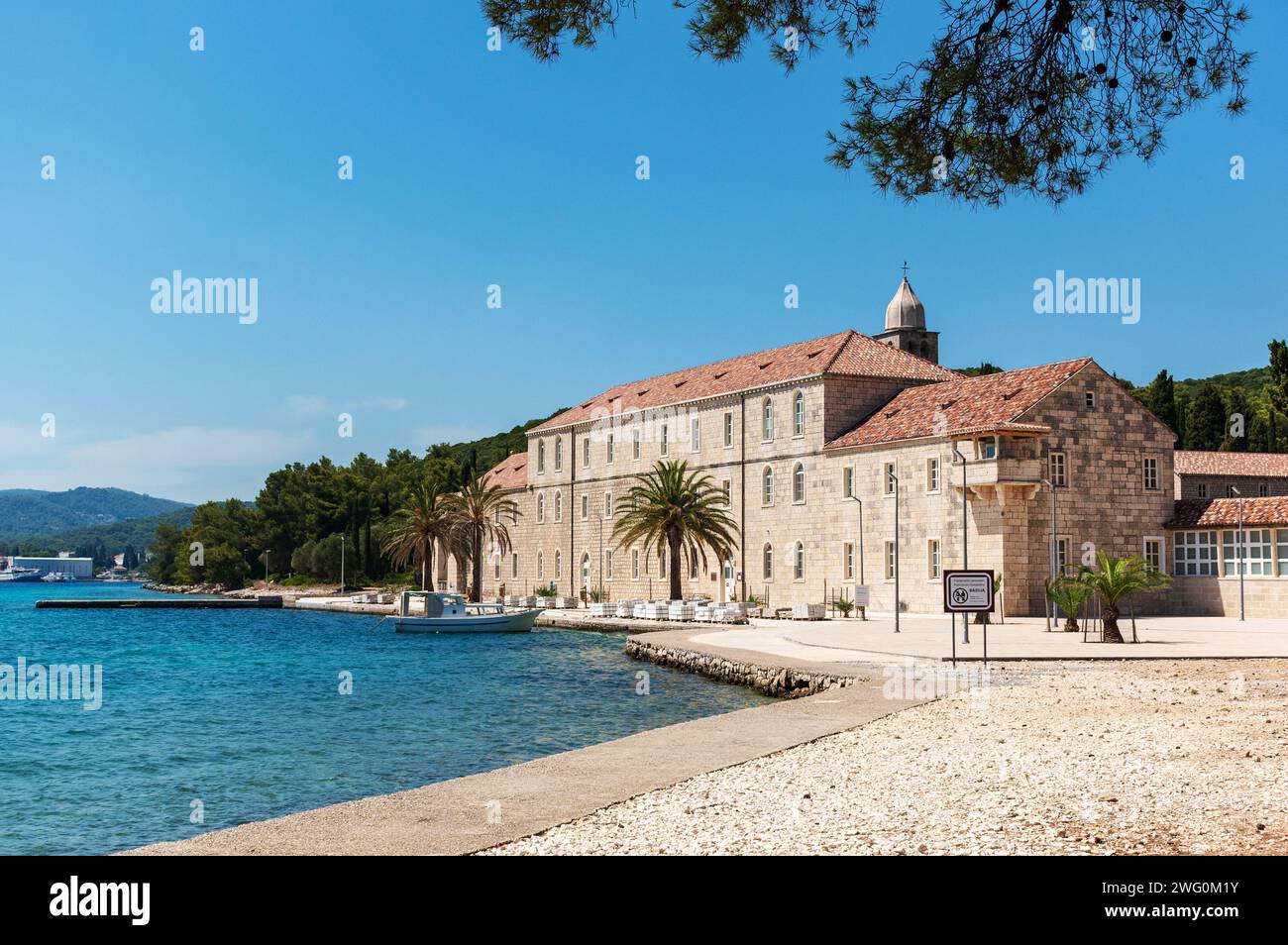 Beautiful, stone made Badija island monastery, with red clay rooftop ...