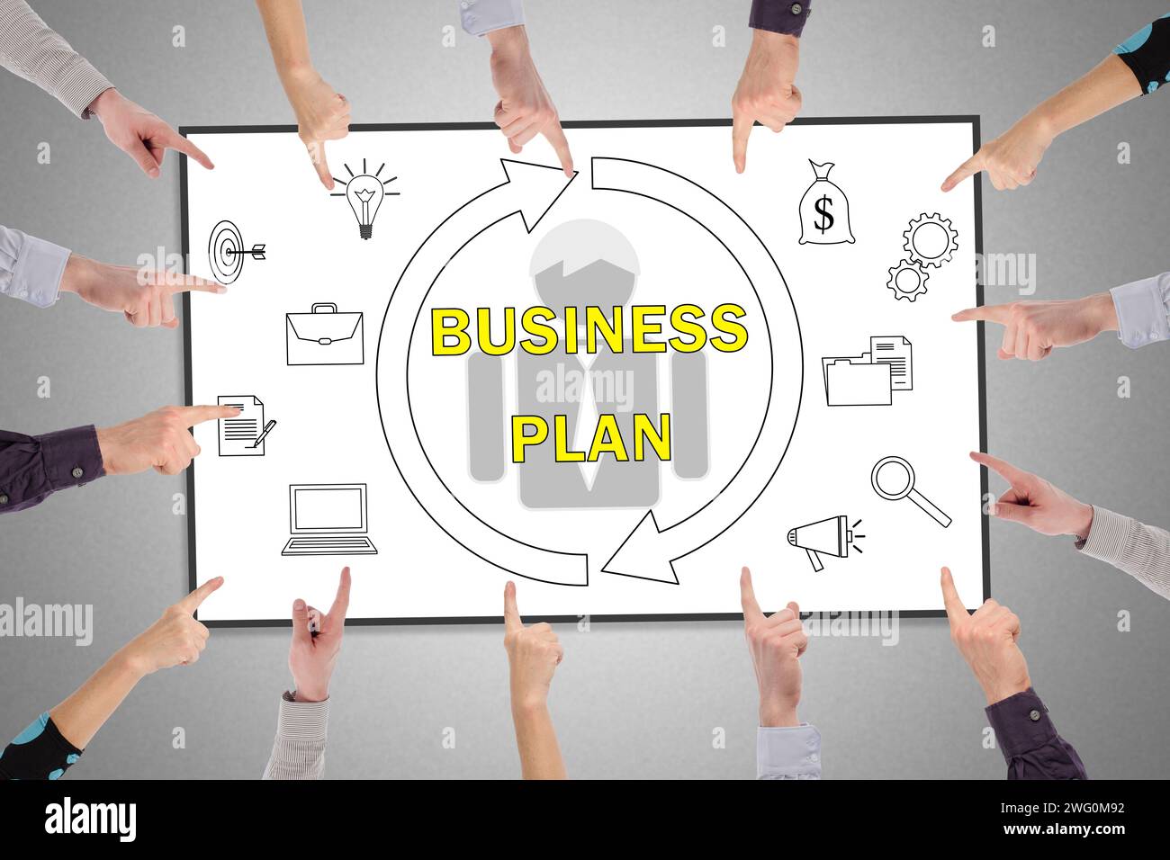 Hands pointing to business plan concept Stock Photo - Alamy