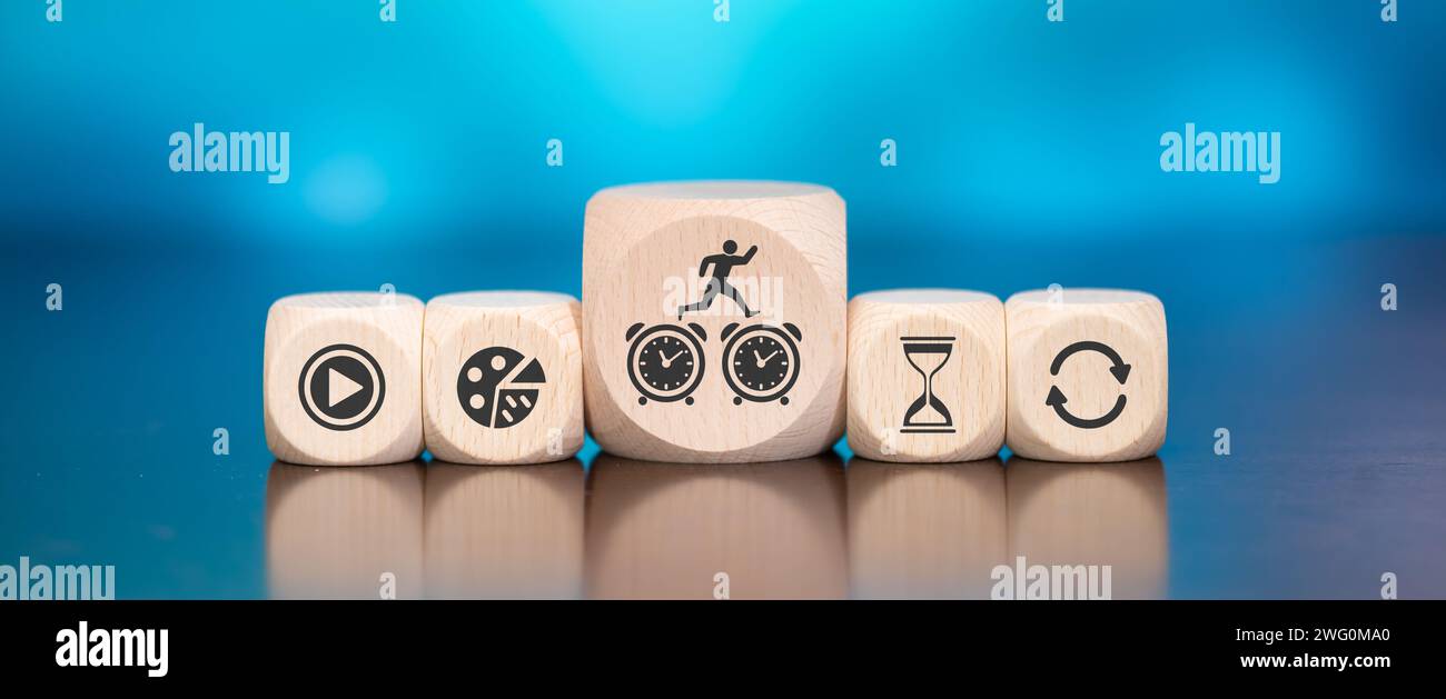 Wooden blocks with symbol of time management concept on blue background ...