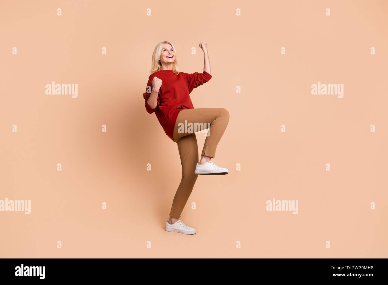 Full length photo of lucky cheerful lady dressed red pullover rising ...
