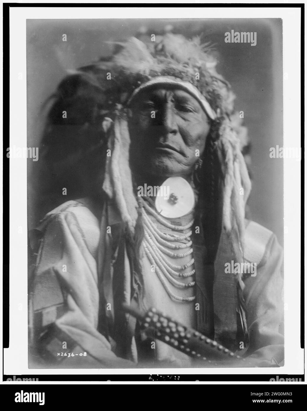 Bear Cut Ear, c1908. Head-and-shoulders portrait of Crow man Stock ...