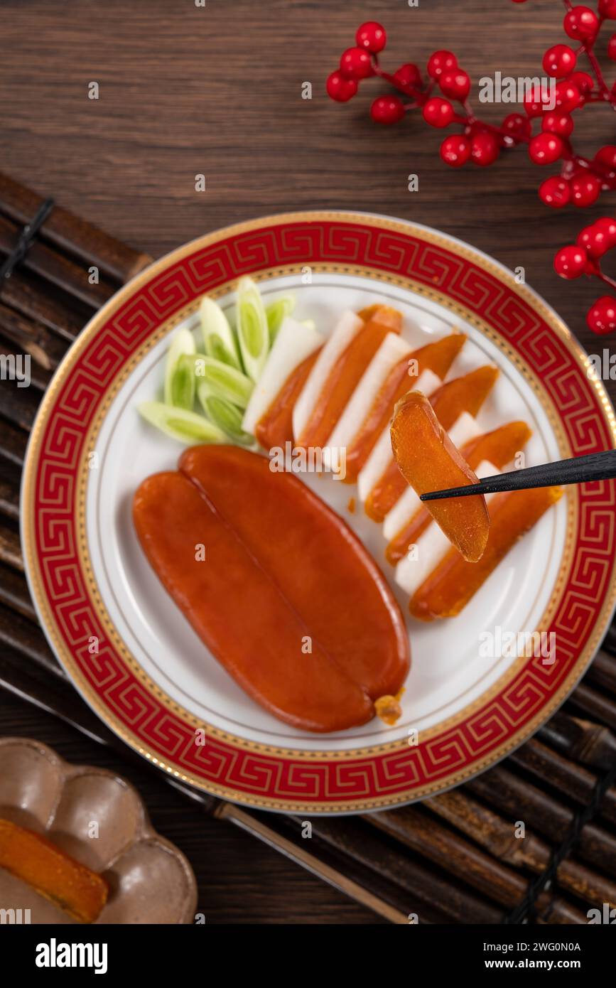 Delicious fresh mullet roe with white radish slices and garlic sprout ...