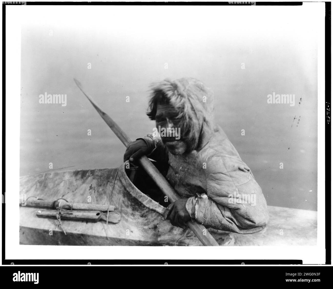 The seal-hunter, Noatak, in kayak, facing left, c1929 Stock Photo - Alamy