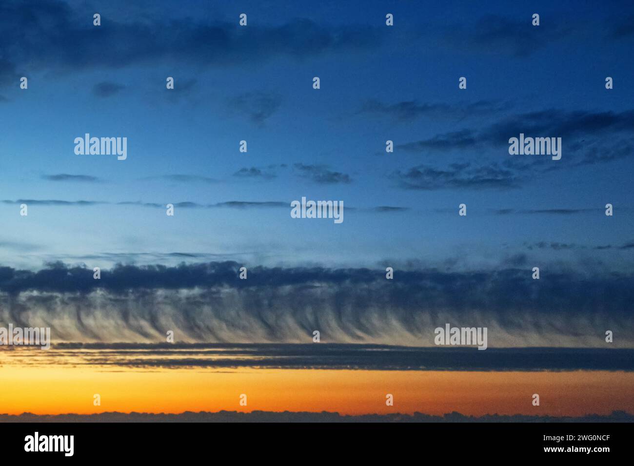 Unusual clouds in the post-sunset hour, like clouds of long straight ...